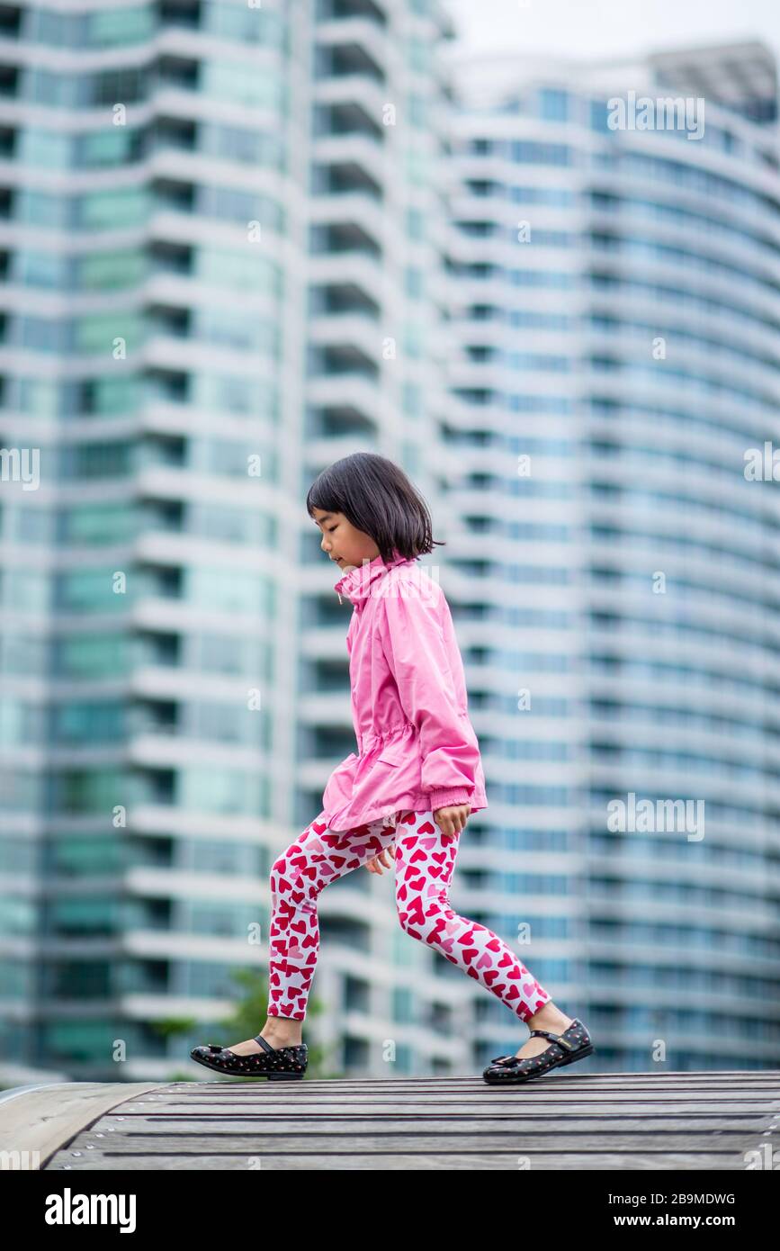 A girl walking in downtown Toronto Stock Photo - Alamy