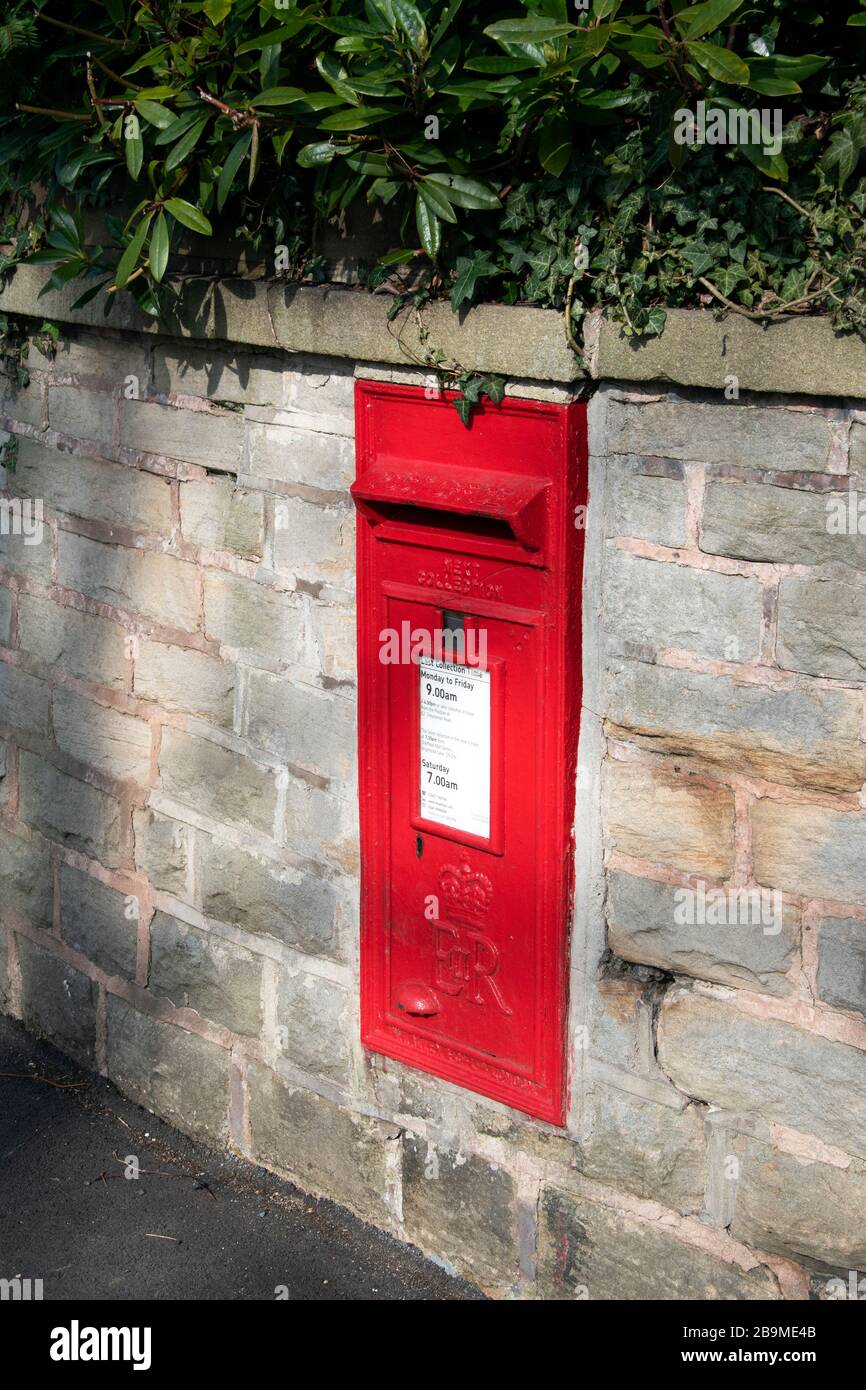 Red postal box in brick wall Stock Photo - Alamy
