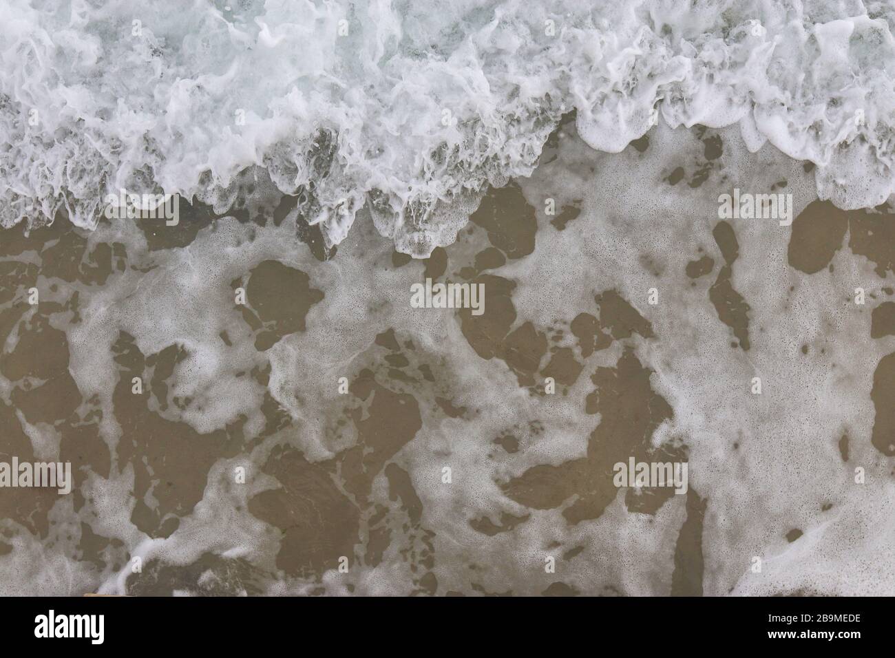 Beach texture. Golden sand and sea foam pattern. Beach background with ...