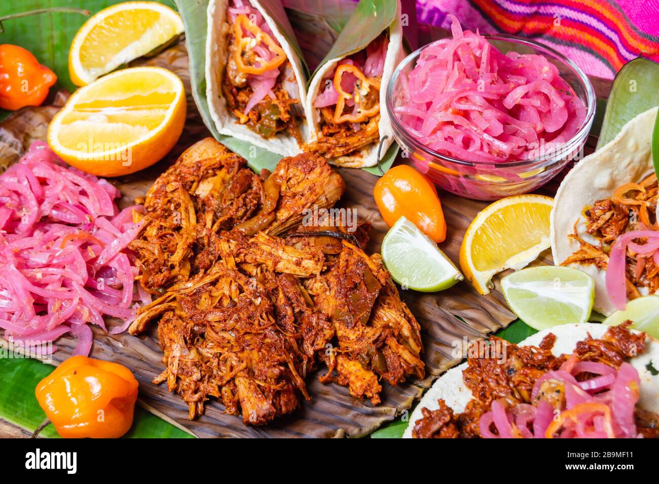 Cochinita Pibil, Mexican pit-roasted pork dish from Yucatan, on banana ...