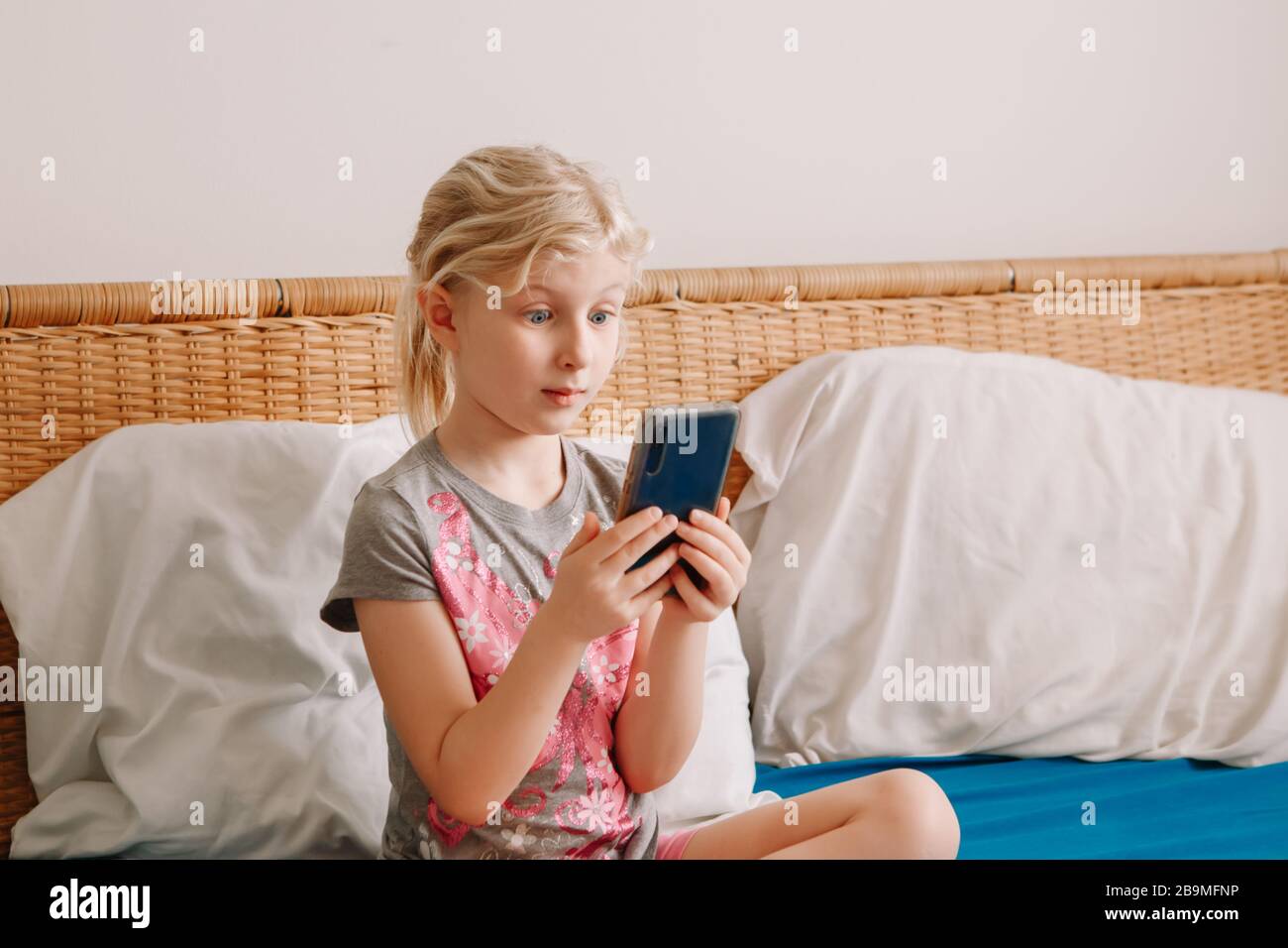 Cute adorable Caucasian girl stay at home and call her friends on ...