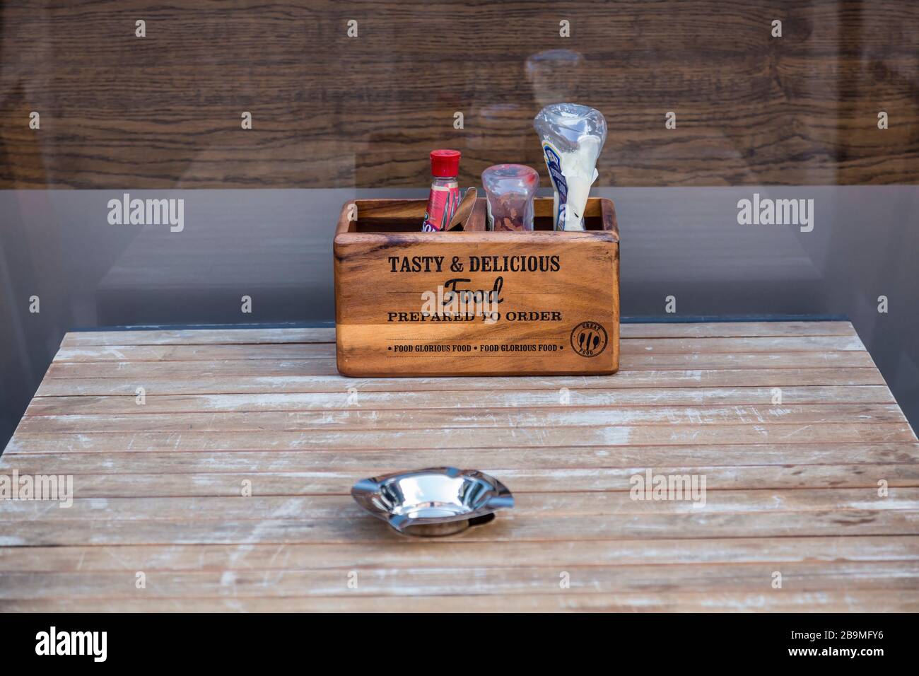 A bar table with condiments in Glasgow city centre, Scotland, UK ...