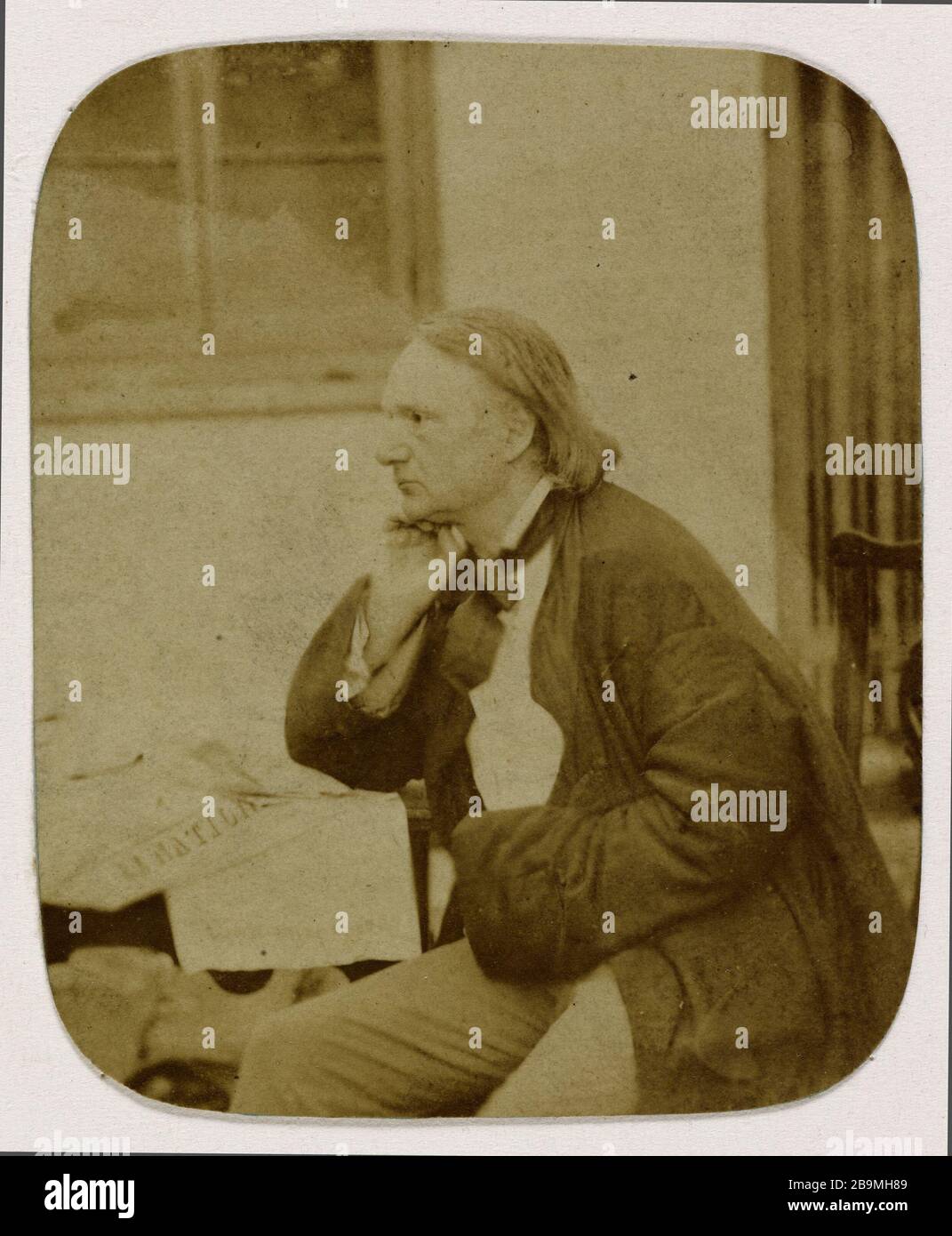 Victor Hugo left profile, leaning on a table, right hand supporting his ...