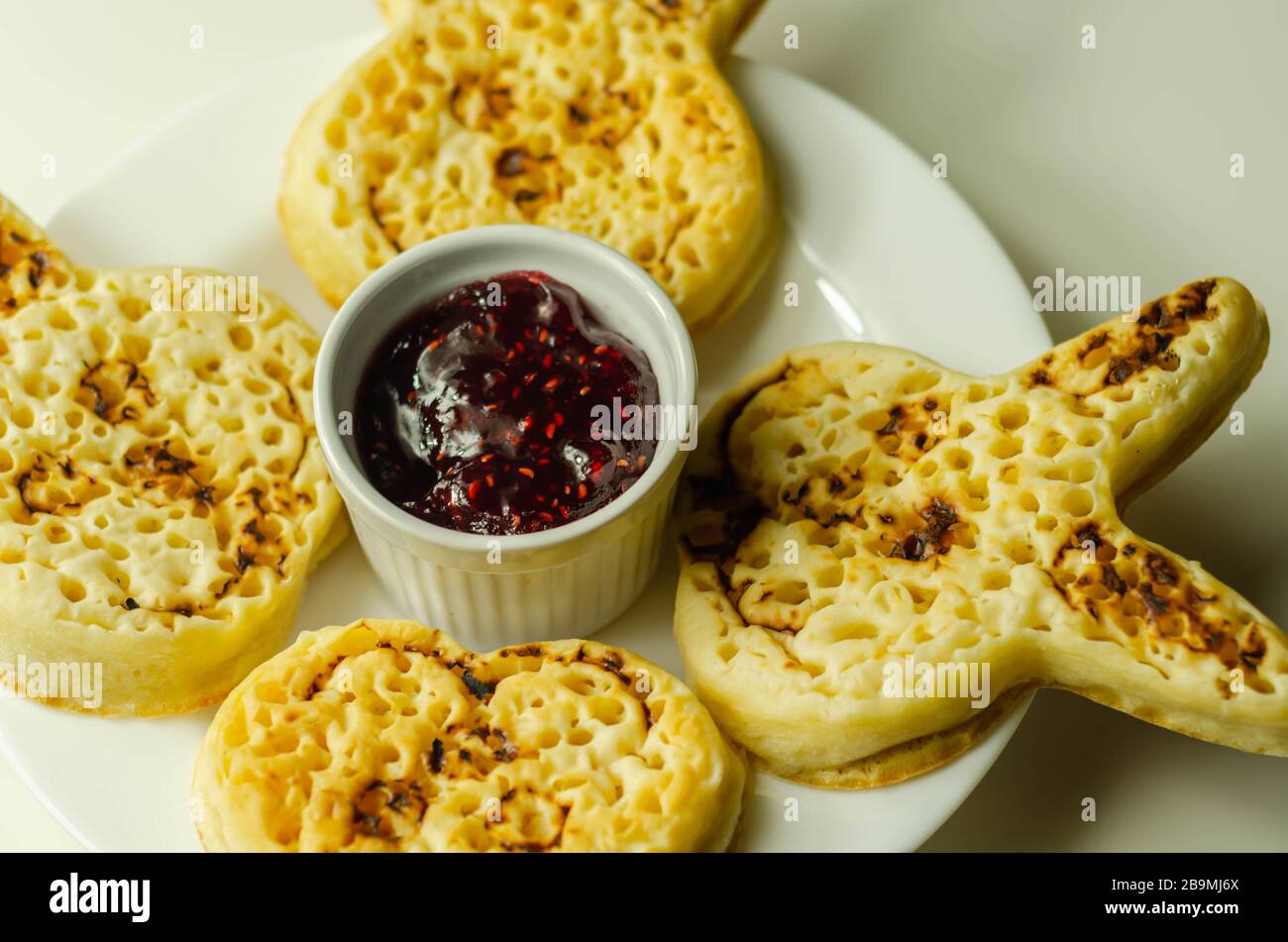 Easter nice bunny shaped crumpets served with raspberry jam, funny food ...