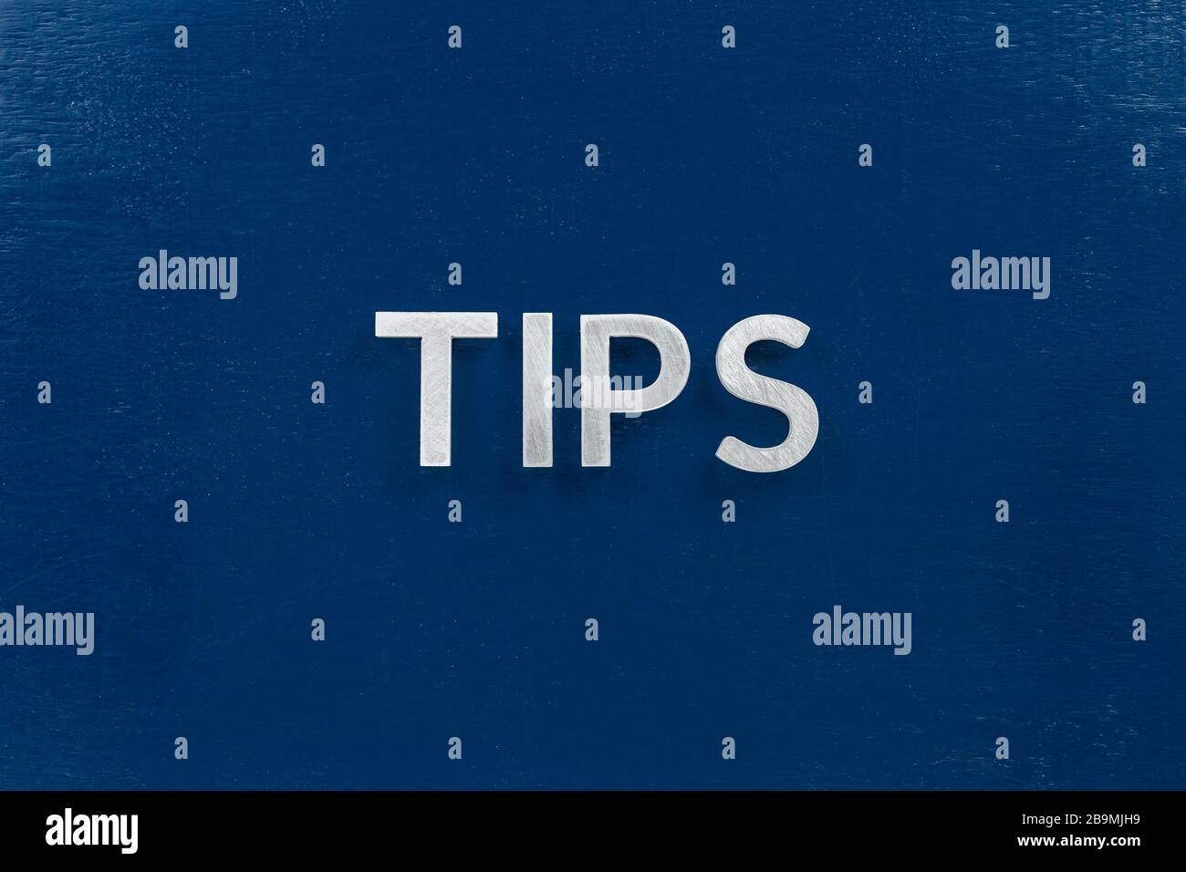 the word tips laid with silver letters on blue color surface Stock ...