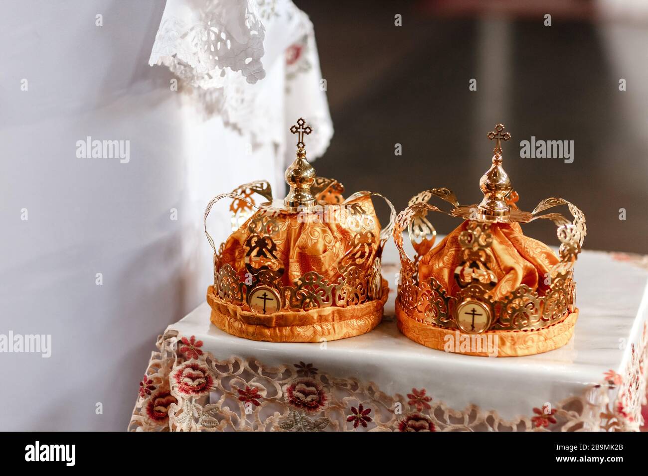 wedding Golden crowns on the table in church. Wedding crowns in church ...