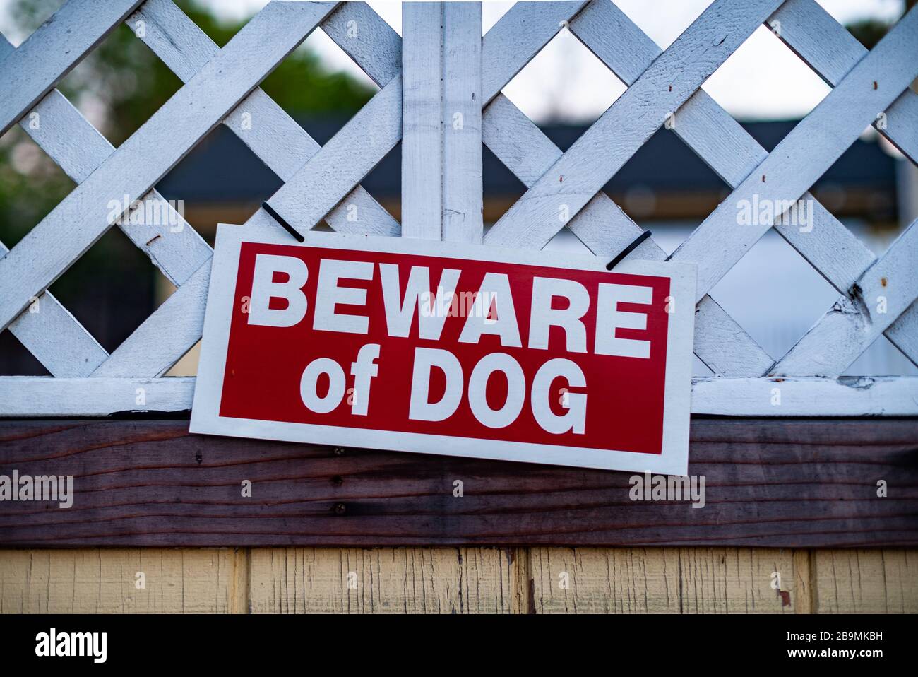beware of guard dog sign on wooden gate Stock Photo - Alamy