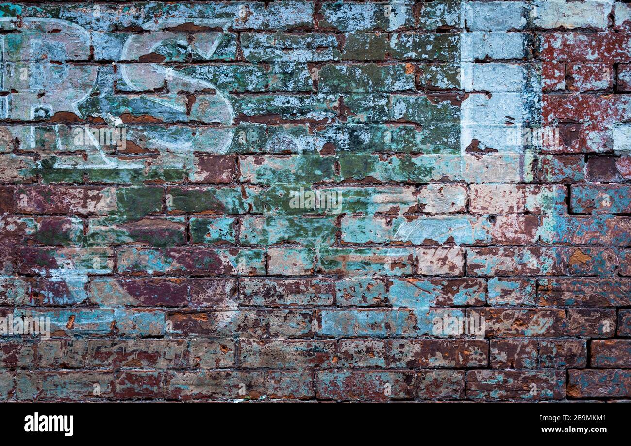 old faded and distressed exterior brick wall background Stock Photo - Alamy