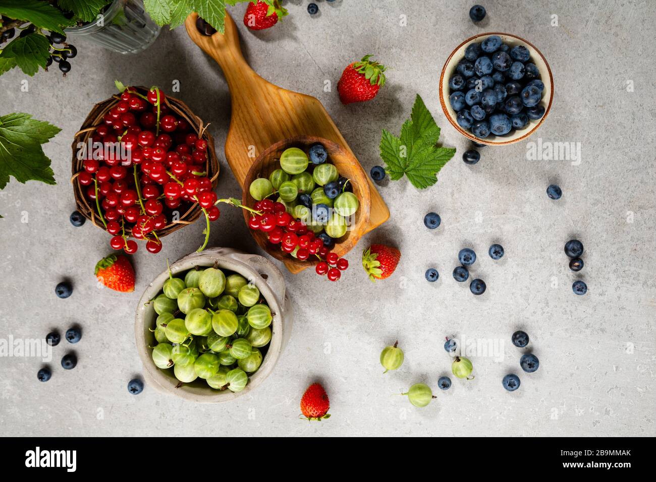 Overhead view of summer berry on gray surface Stock Photo - Alamy