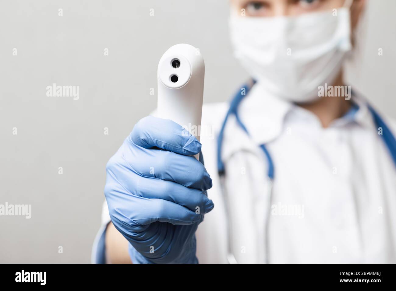 Close-up shot of doctor wearing protective surgical mask ready to use ...