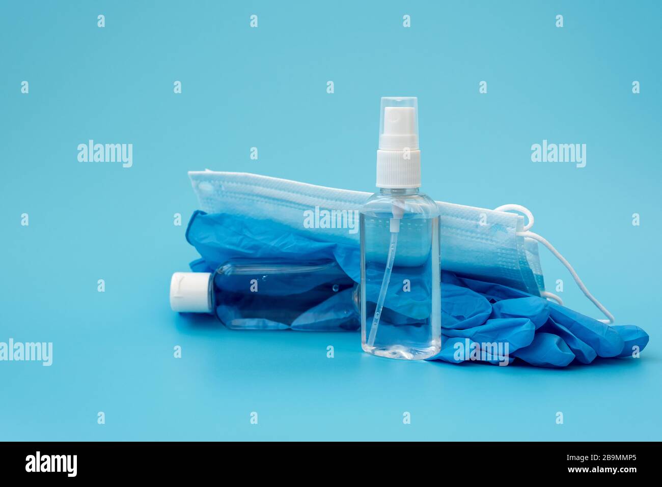 Set of antiseptic items. Wearing mask, medical gloves, bottles of ...
