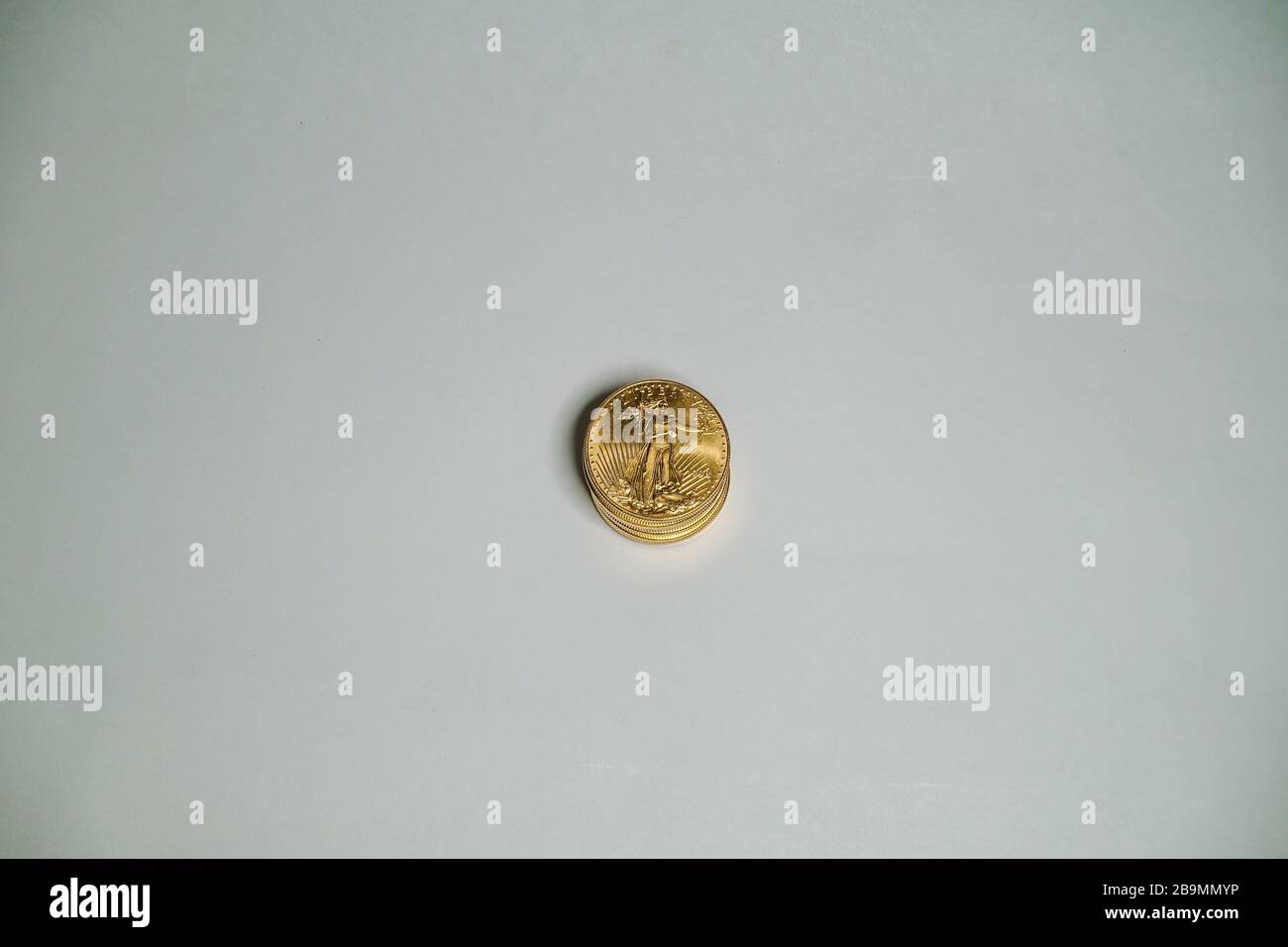 Orlando, FL/USA-3/9/20: A stack of gold coins. Concept money, riches ...