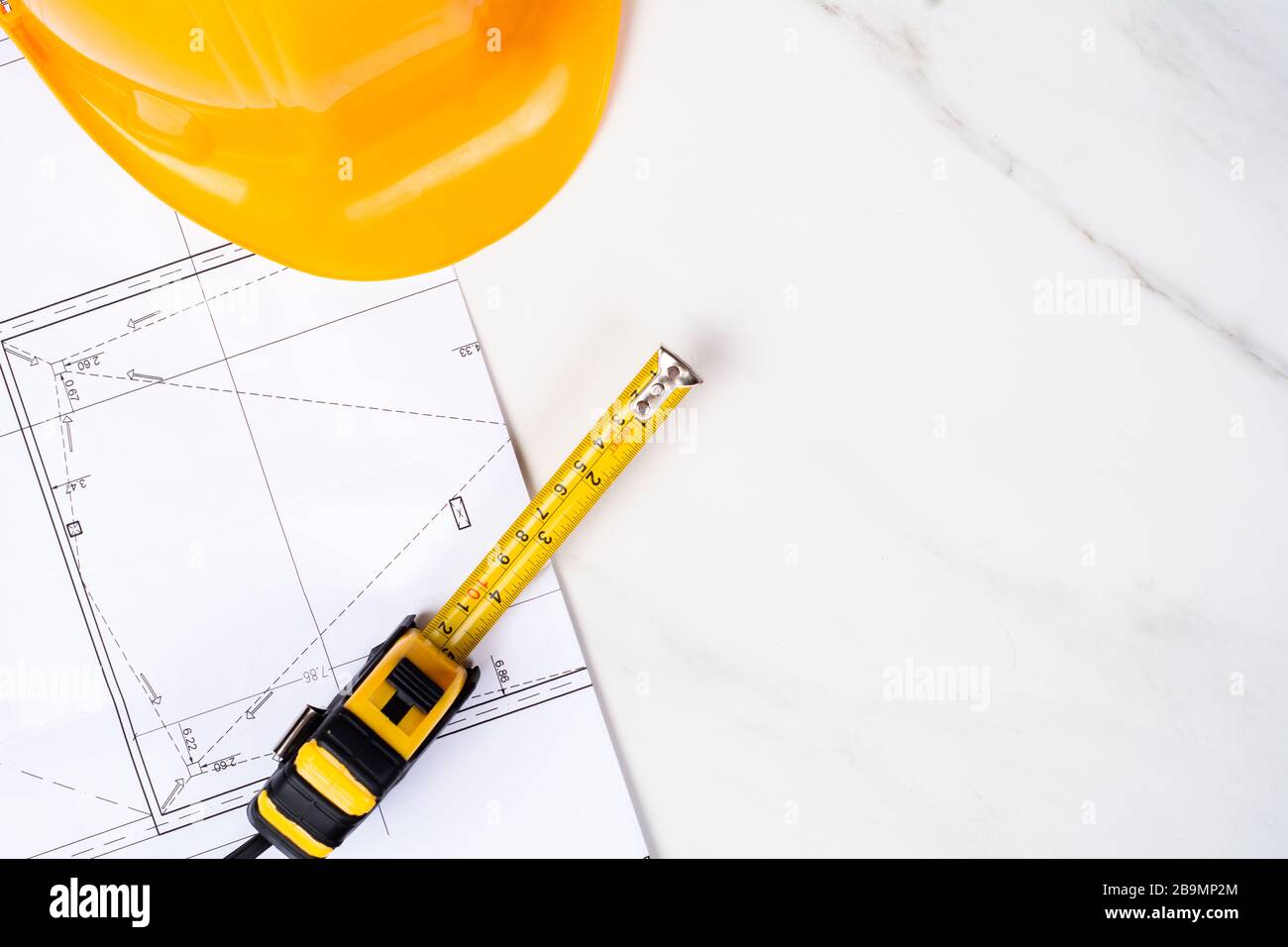 Builder measuring blueprints tape hi-res stock photography and images ...