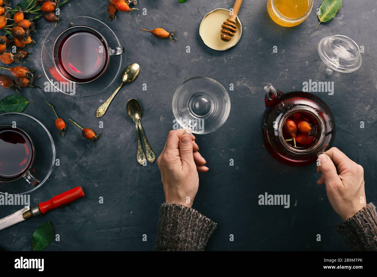 Preparation of vitamin tea with rose hips. Homemade tea party Stock ...
