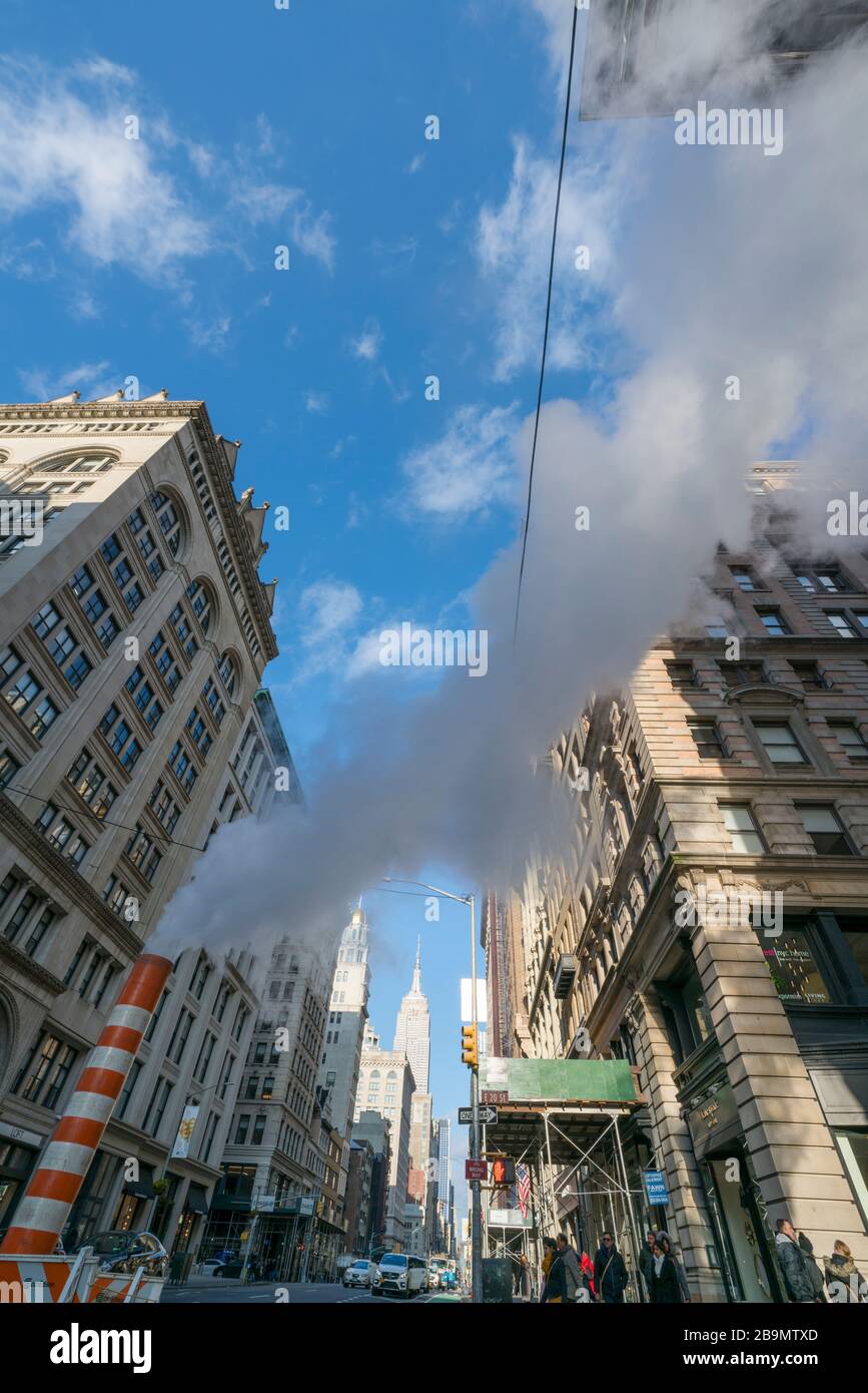 The steam rises and drifts among the Midtown Manhattan buildings in New ...