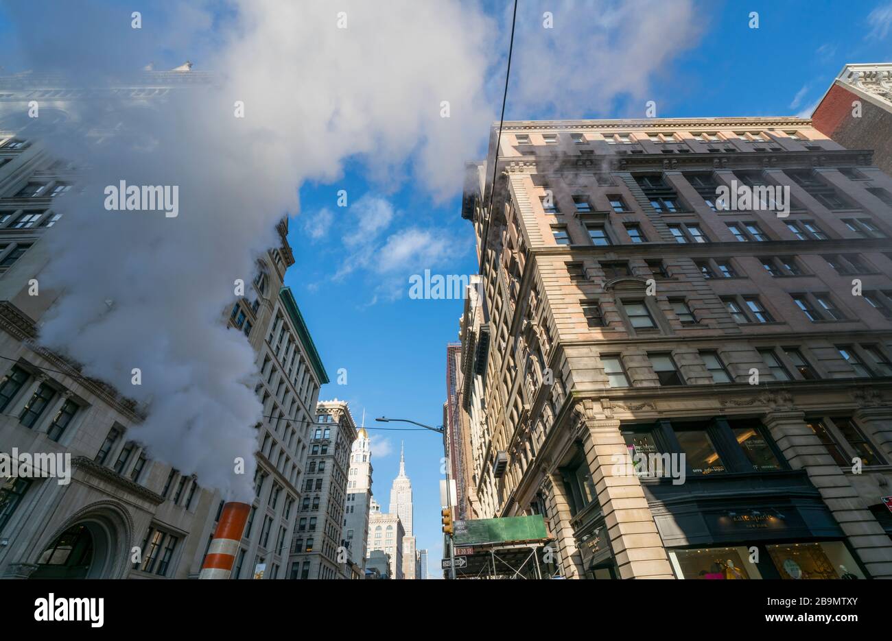 The steam rises and drifts among the Midtown Manhattan buildings in New ...