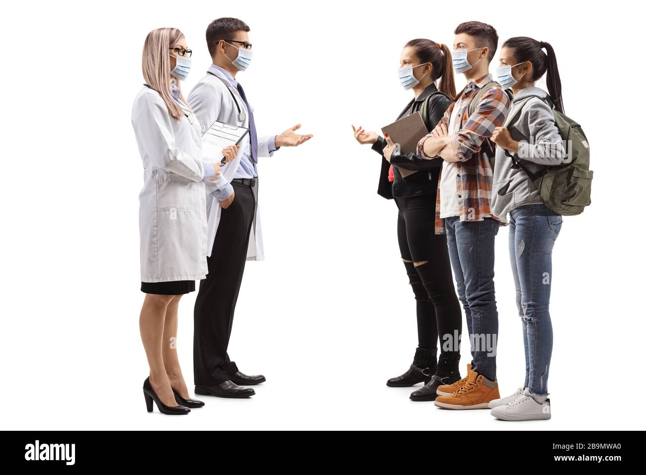 Full length profile shot of a male and female doctor with medical masks ...