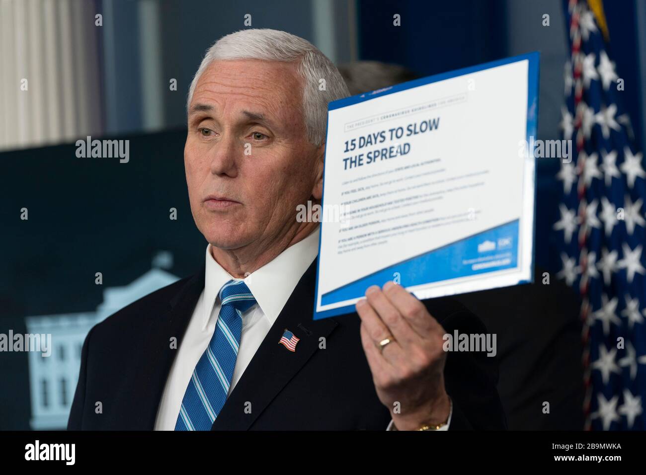 United States Vice President Mike Pence holds a chart as he speaks ...