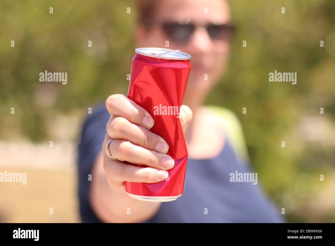 Squeezing A Soda Can Closeup Stock Photo - Alamy