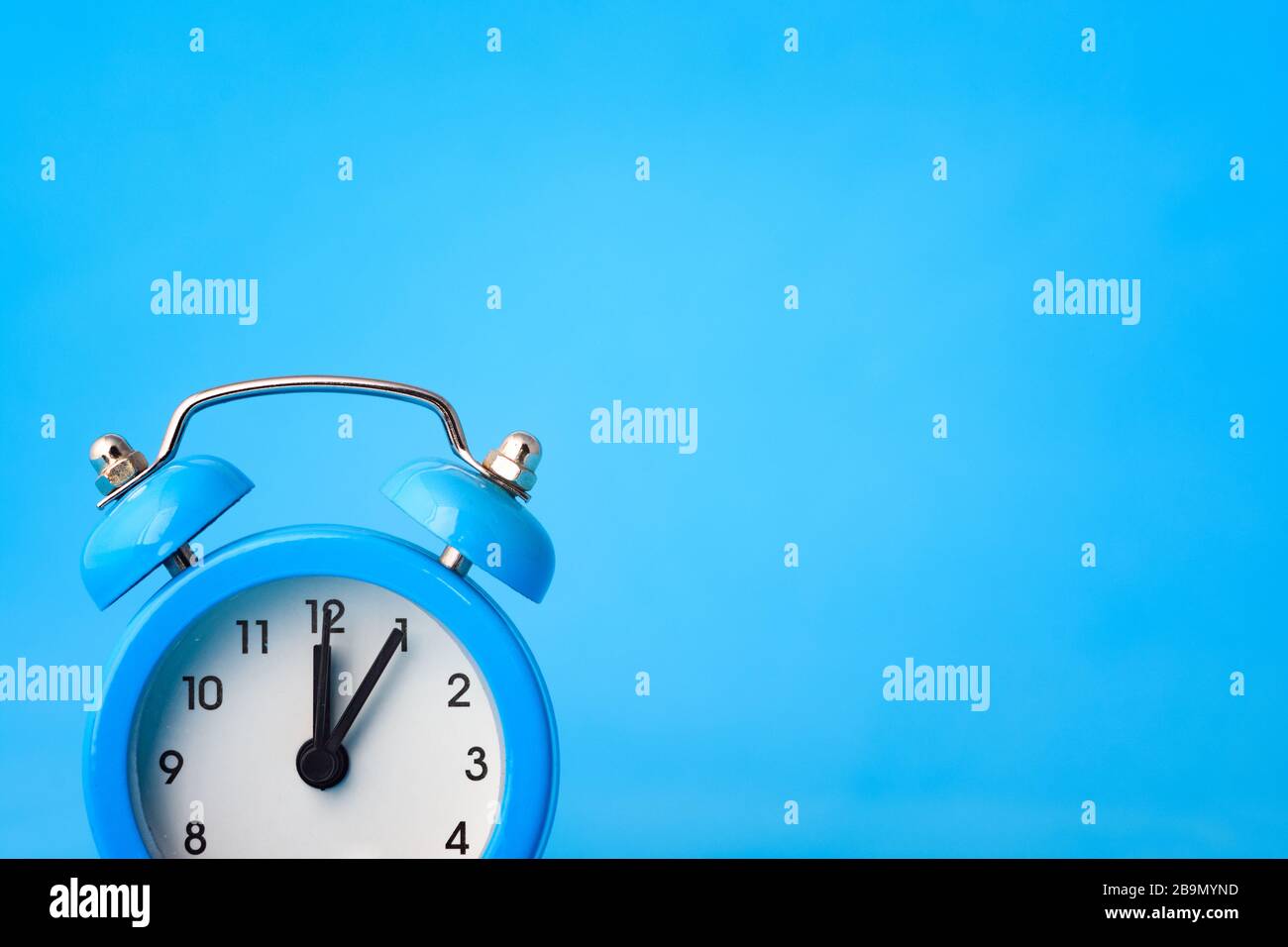 Clock concept - time, right empty place, blue background Stock Photo ...