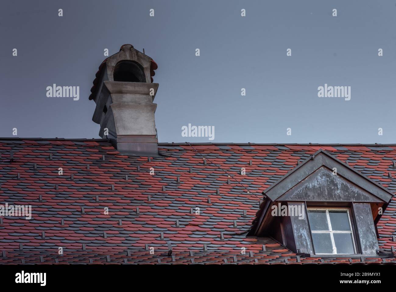 Roof of a vintage building with a window Stock Photo - Alamy