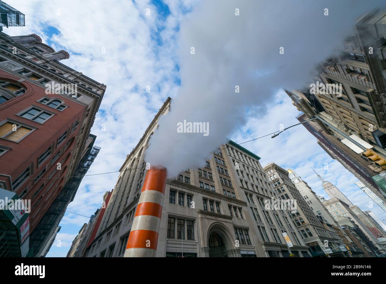The steam rises and drifts among the Midtown Manhattan buildings in New ...