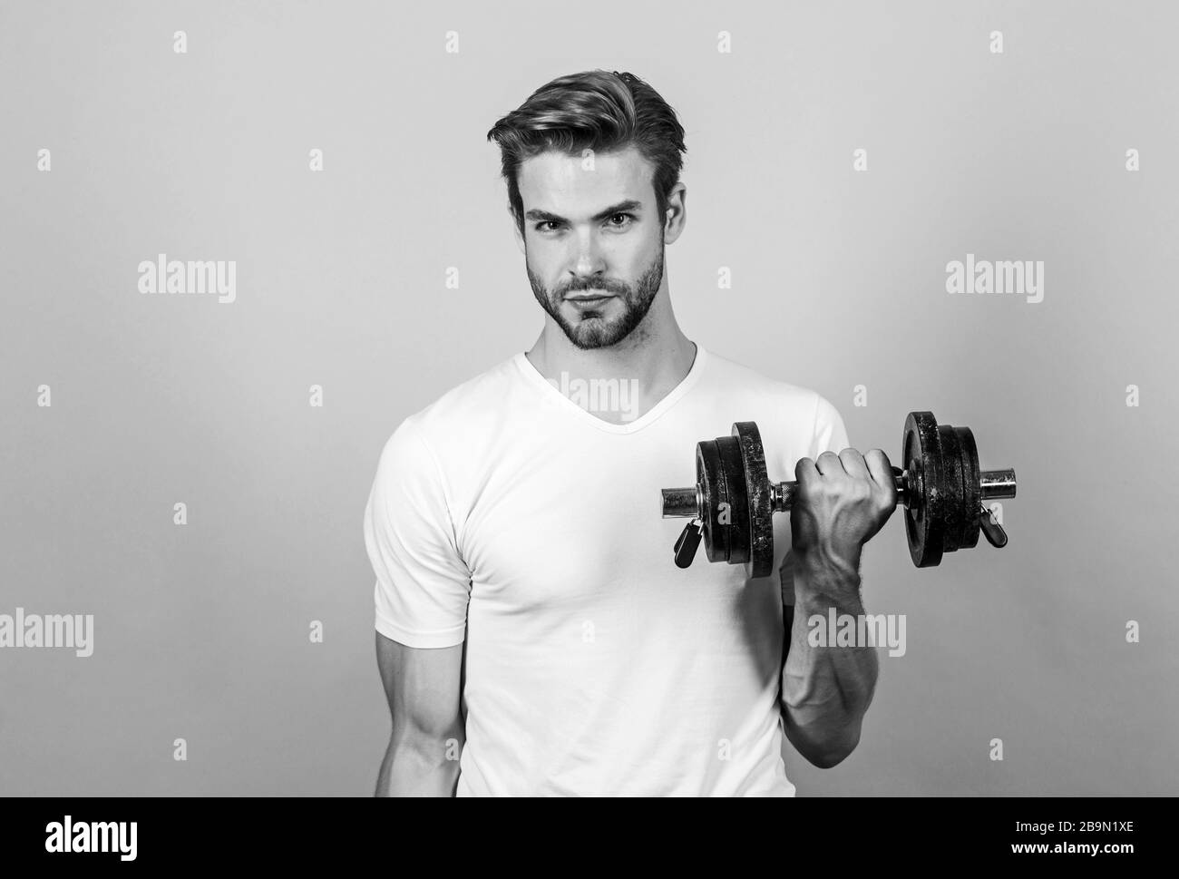 Strong muscles and power. man lifting barbell. sportsman training in ...