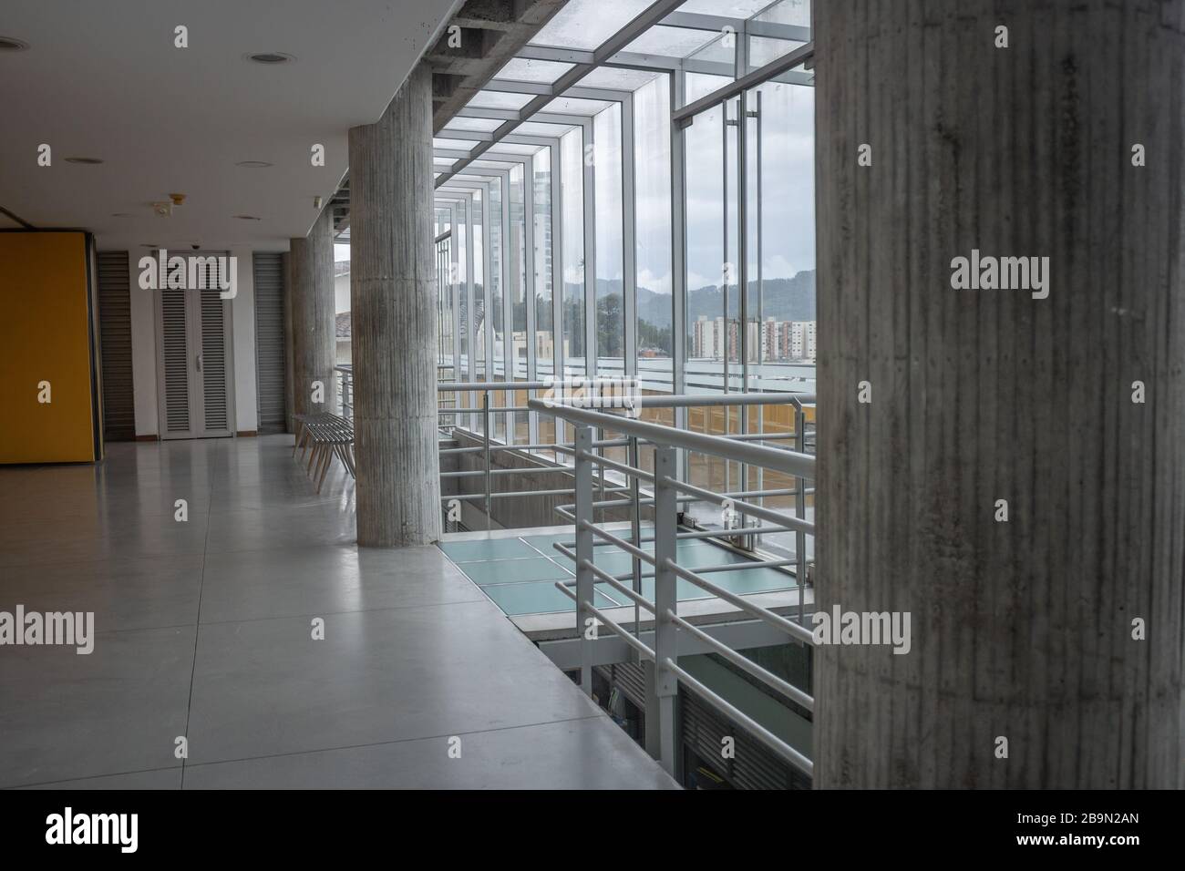 interior architecture with windows and posts with city and mountains ...
