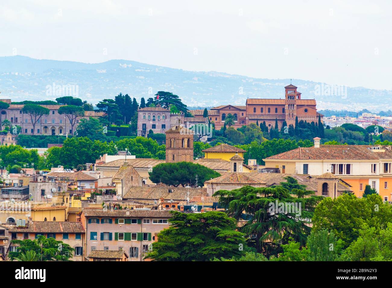 Scenic view of historic Rome city seen through the trees in Parco del ...