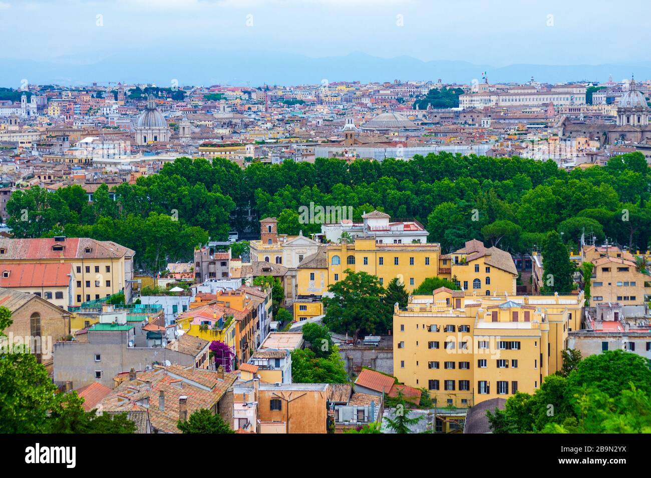 Scenic view of historic Rome city seen through the trees in Parco del ...