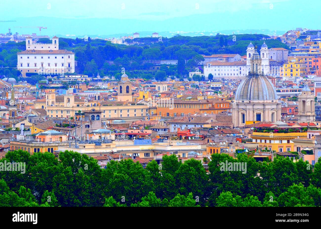 Scenic view of historic Rome city seen through the trees in Parco del ...