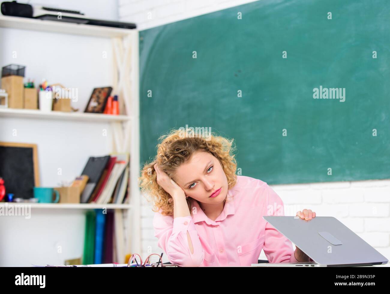 Tired tutor fall asleep at workplace. Woman tired in school classroom ...