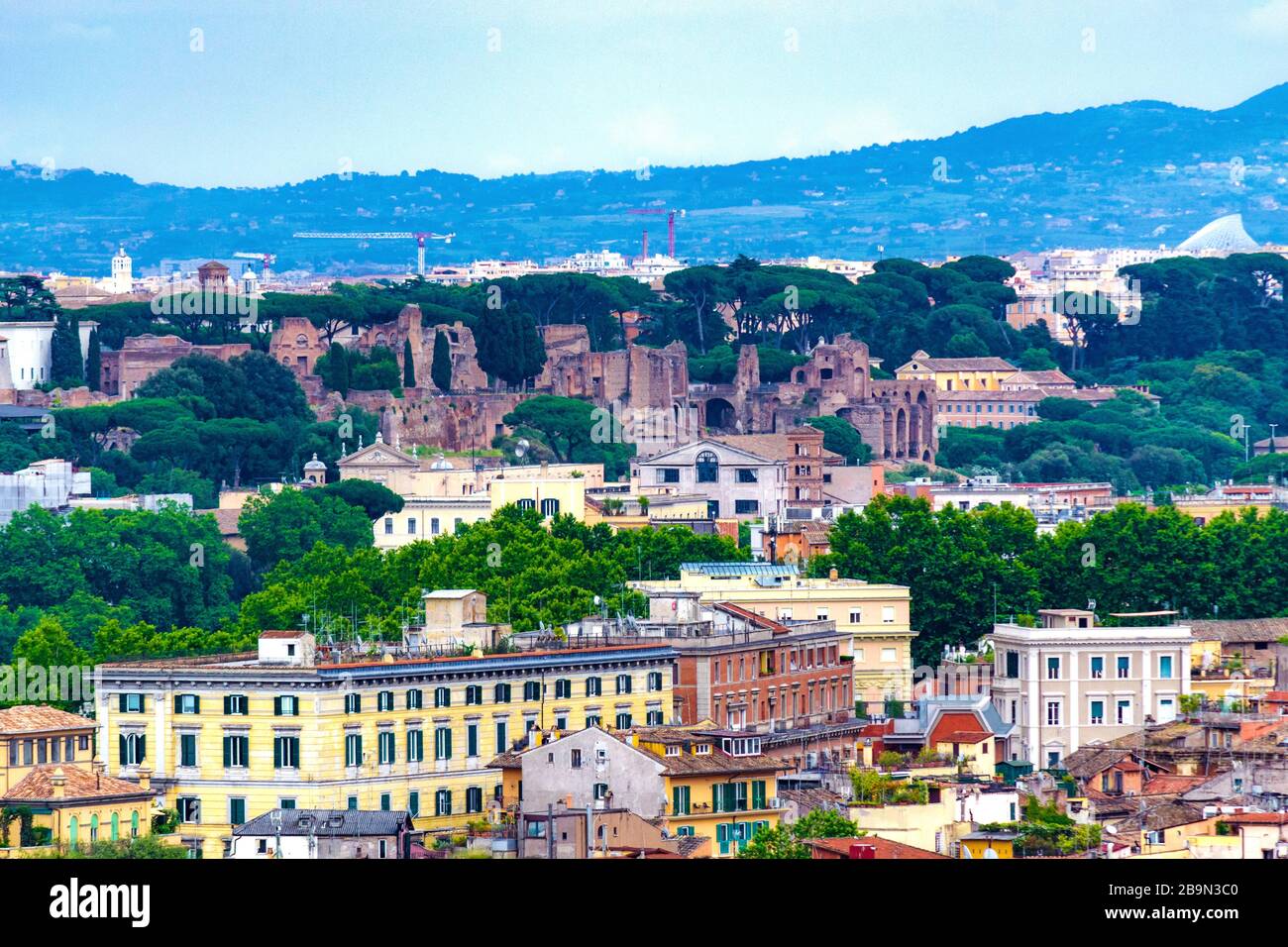 Scenic view of historic Rome city seen through the trees in Parco del ...