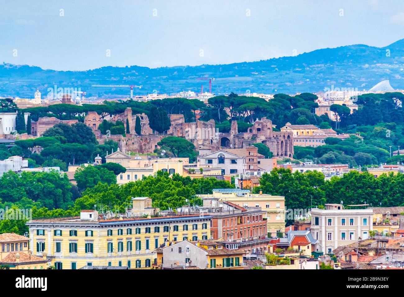 Scenic view of historic Rome city seen through the trees in Parco del ...