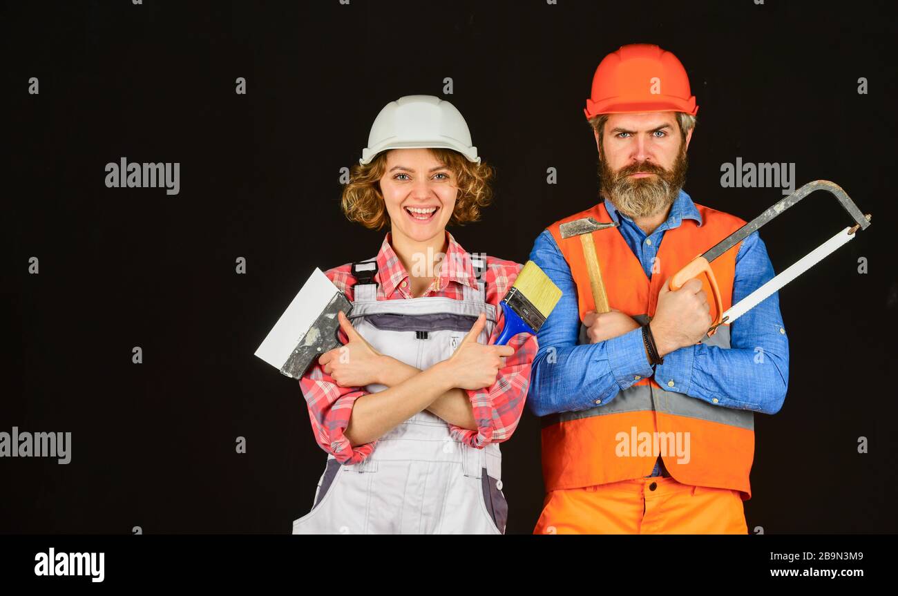 imagine their new house. Portrait of confident handyman and his female ...