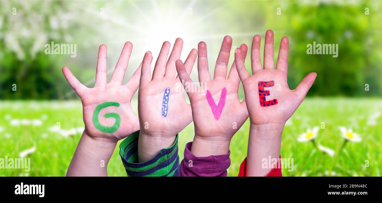 Children Hands Building Word Give, Grass Meadow Stock Photo - Alamy