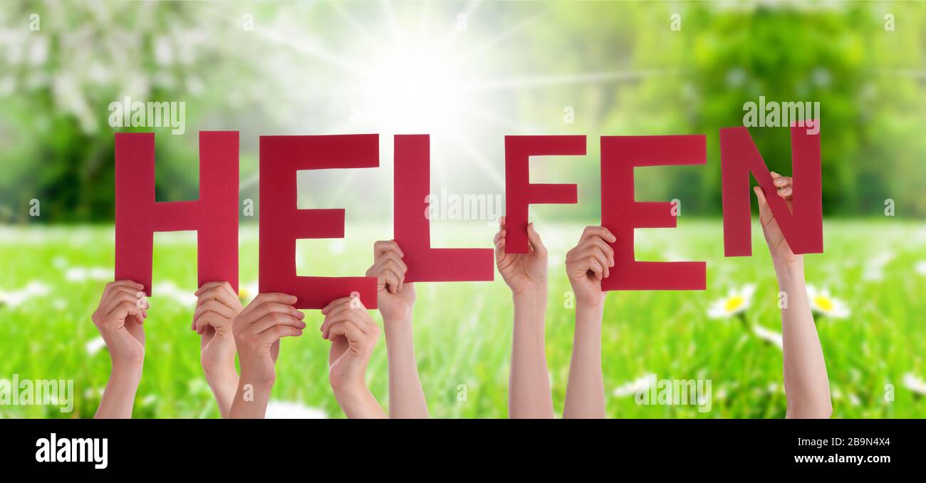 People Hands Holding Word Helfen Means Help, Grass Meadow Stock Photo ...