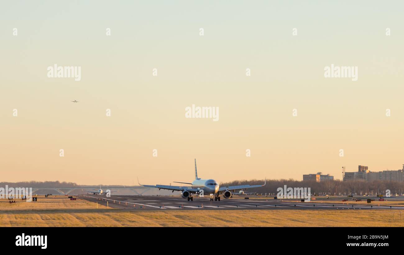 On runway 01 at Reagan National Airport, an aircraft prepares to depart ...