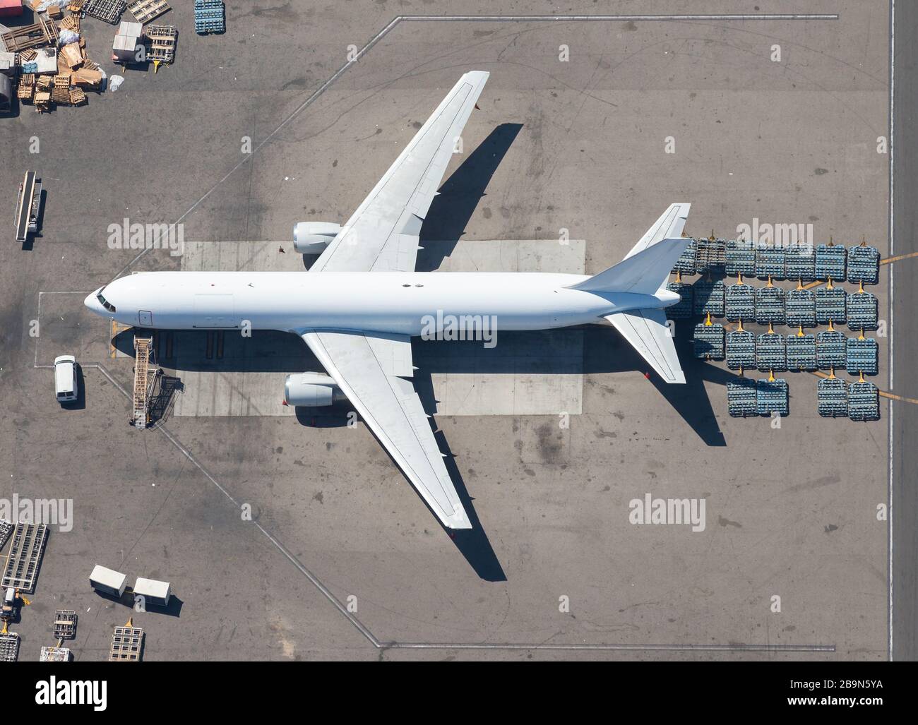 Aerial view of unidentifiable aircraft for freight transport with cargo ...