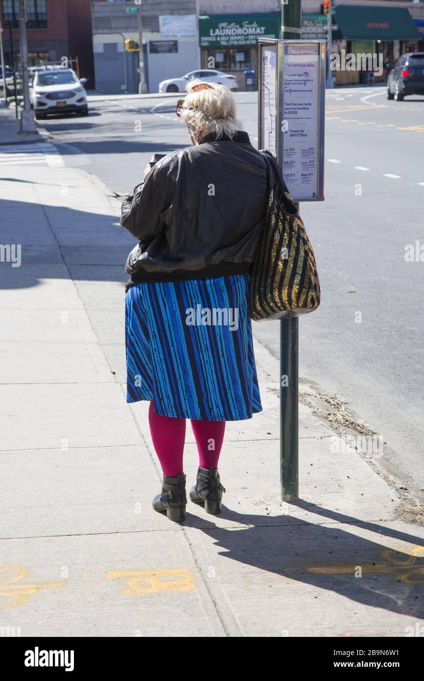 Woman waits city bus hi-res stock photography and images - Alamy