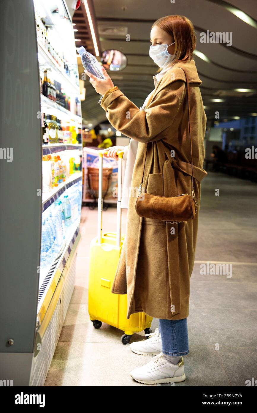 Woman wearing mask reads hi-res stock photography and images - Alamy