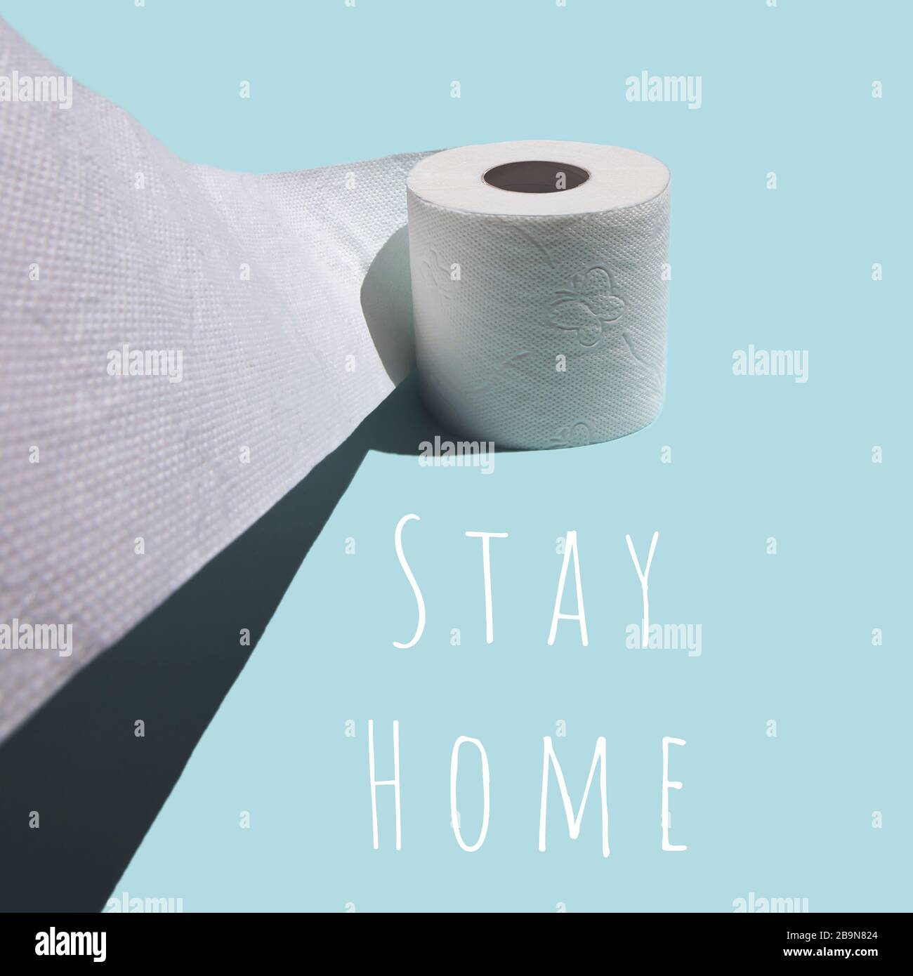 Concept with toilet paper. Against a blue background with a stiff ...