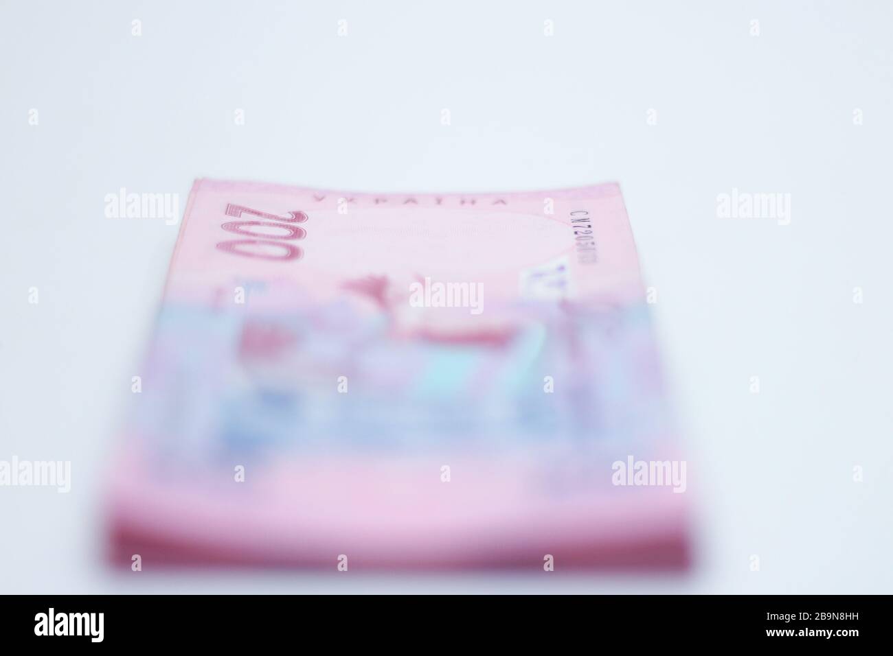 A lot of new banknotes in denominations of 200 Ukrainian hryvnias ...