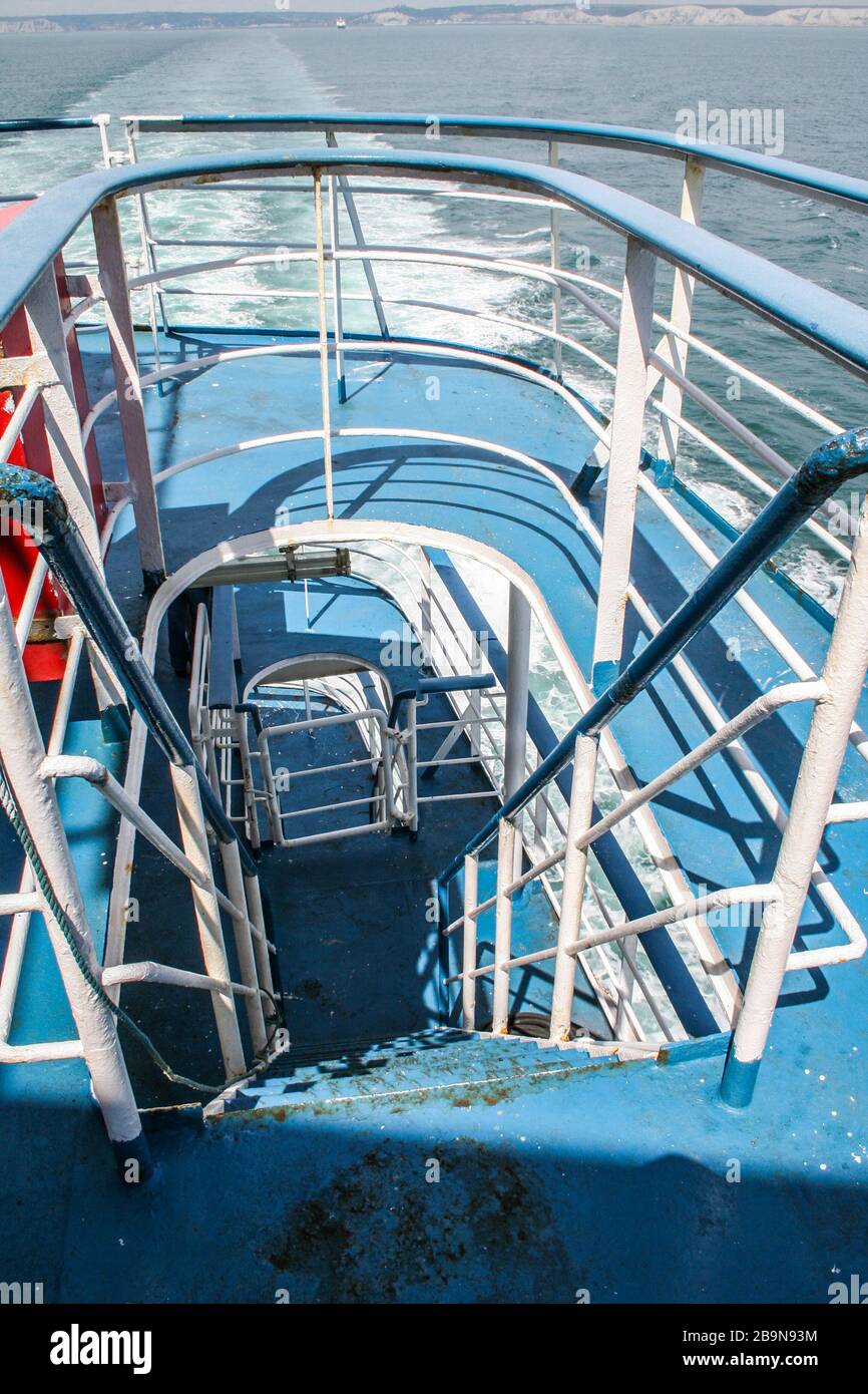 Metal structure fence, close up of a blue ferry on its way to Dover ...