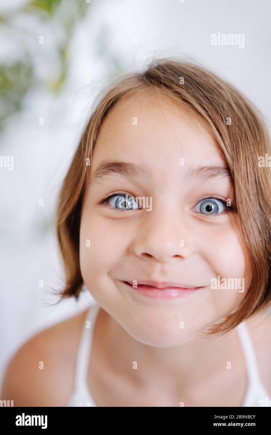 Close up photo of a little girl making funny face Stock Photo - Alamy