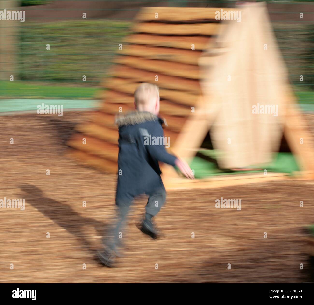 schoolboy running around the playground Stock Photo - Alamy