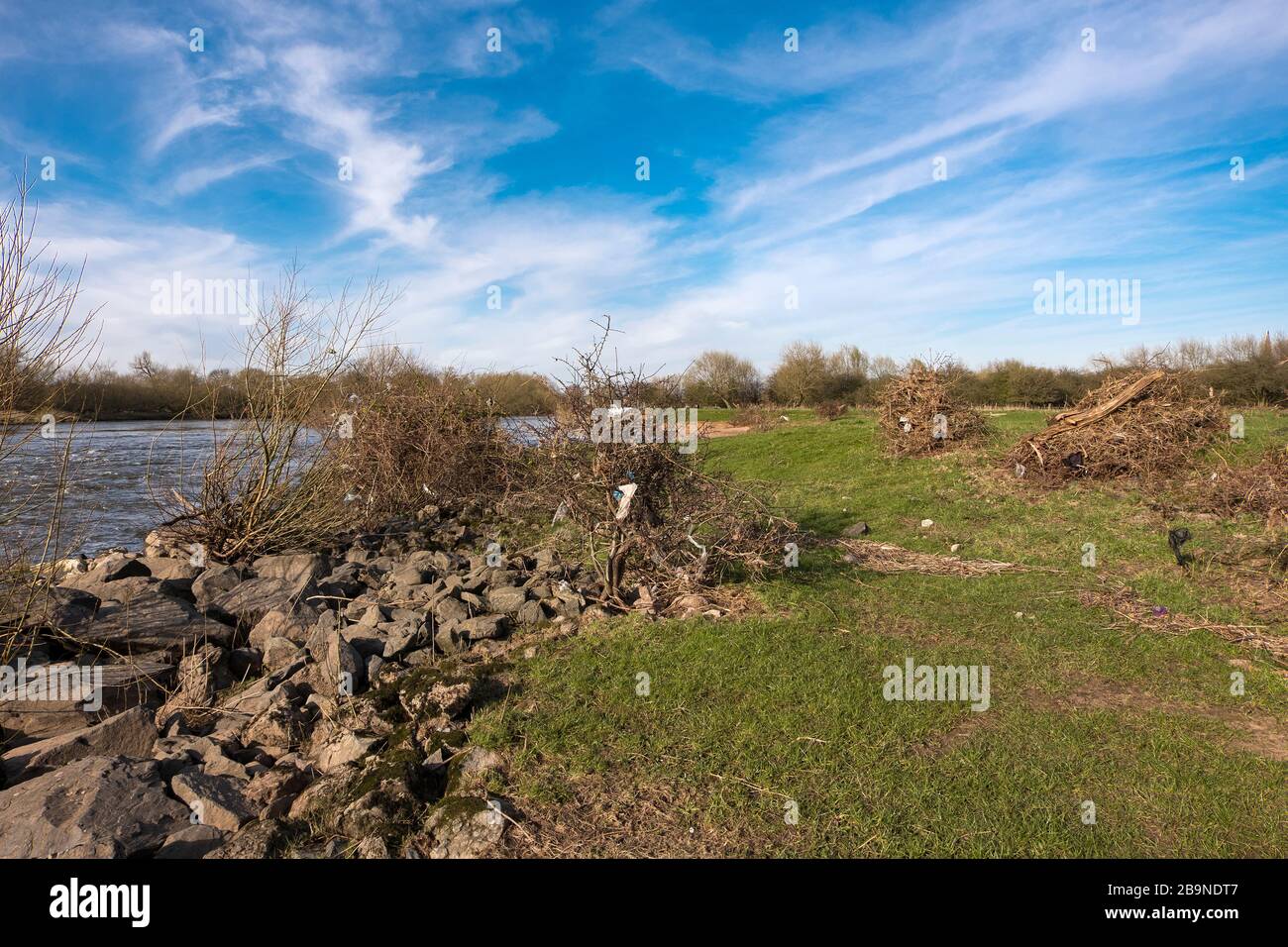 River bank covered in rocks Stock Photo - Alamy