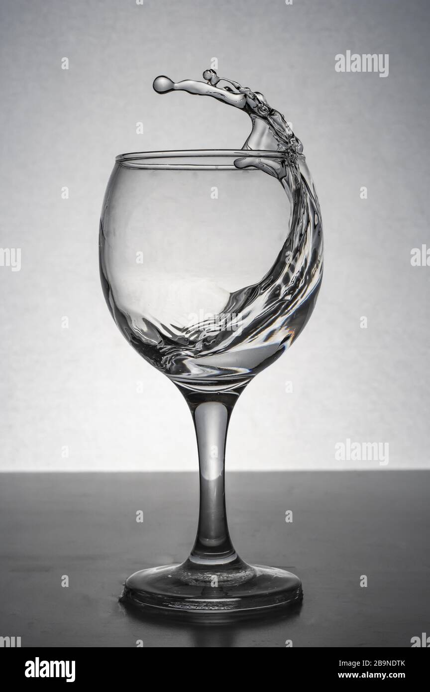 water splashing from glass isolated on white background Stock Photo - Alamy