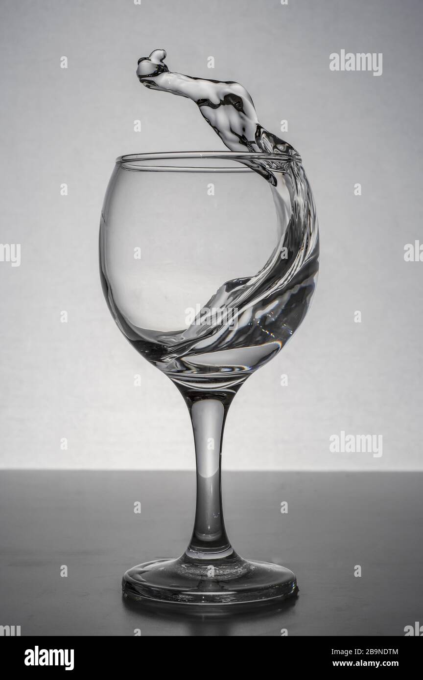 water splashing from glass isolated on white background Stock Photo - Alamy