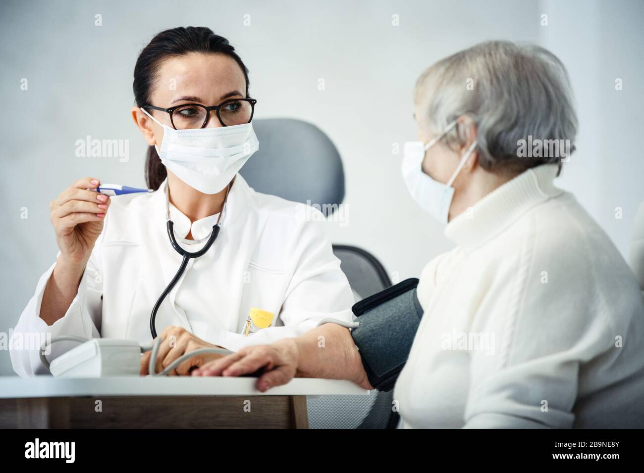 healthcare in hospital concept. female doctor consulting old lady Stock ...